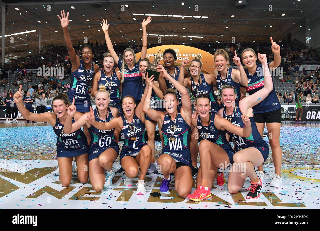 Vixens players celebrate with the trophy after winning the Super ...