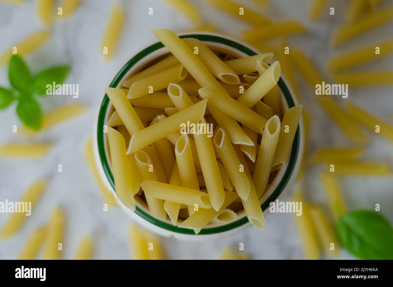 penne pasta in bowl, isolated on white background, top view Stock Photo ...