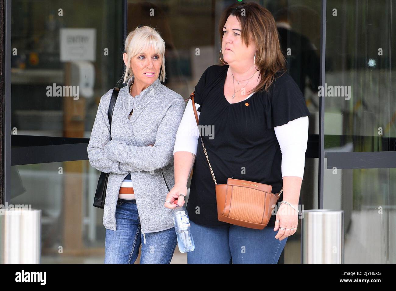 Jodie Reynolds (left), the mother of Nathan Reynolds, leaves during a ...