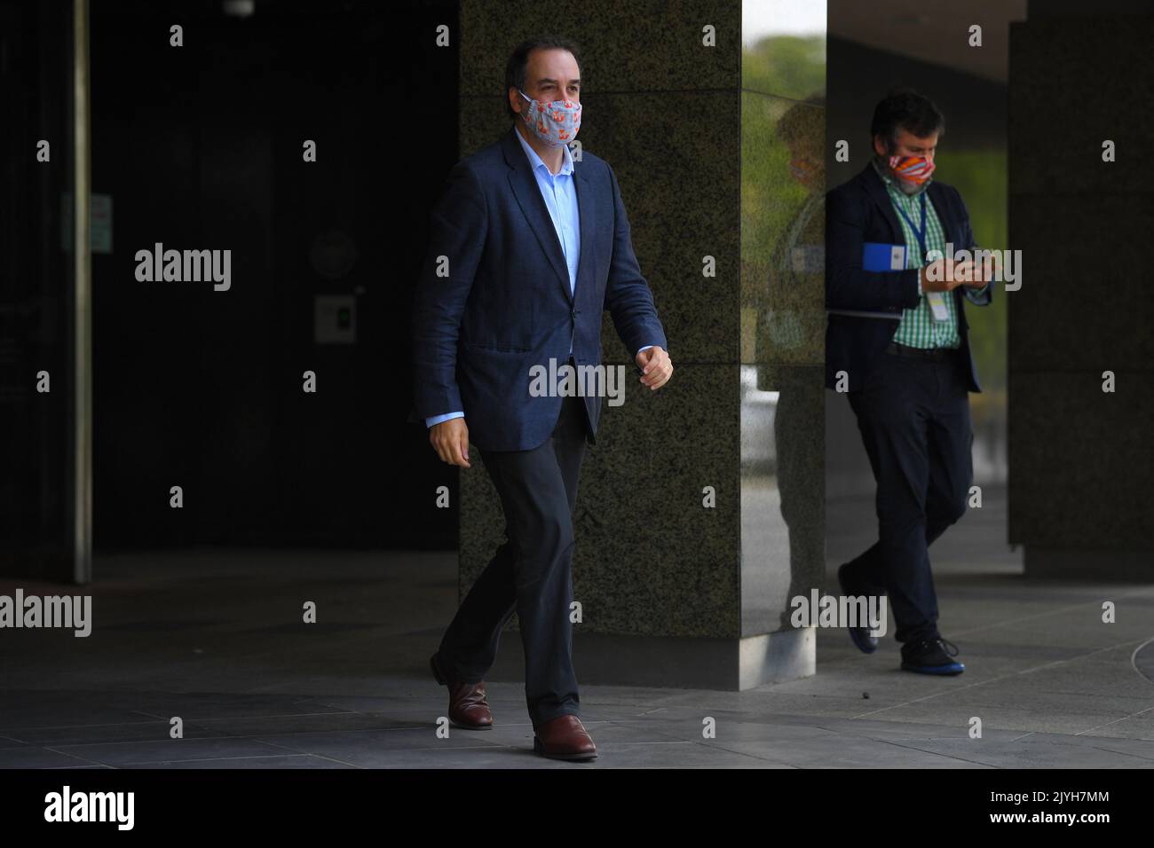 Victoria Racing Minister Martin Pakula (left) arrives to a press ...