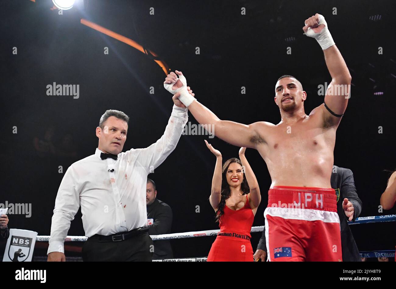 Justis Huni (right) celebrates winning the Australian Heavyweight Title ...