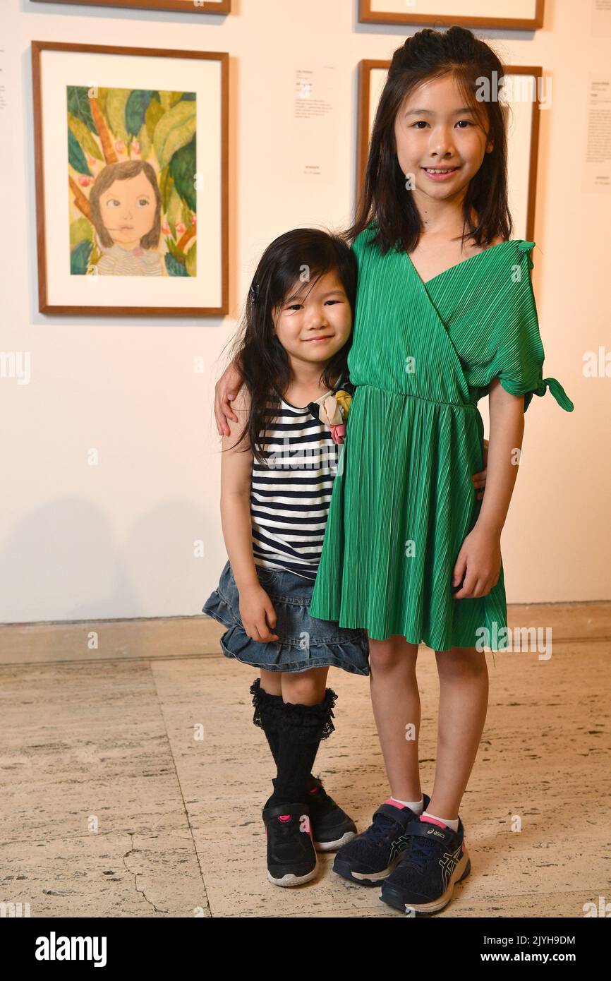 Gabrielle Guo, 7, poses for a photograph her sister Vivienne and her ...
