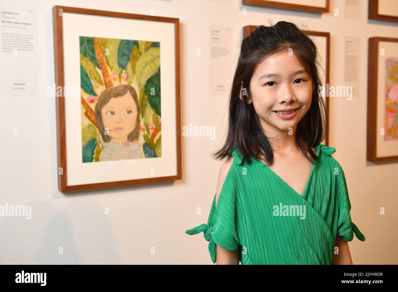 Gabrielle Guo, 7, poses for a photograph with her artwork after being ...