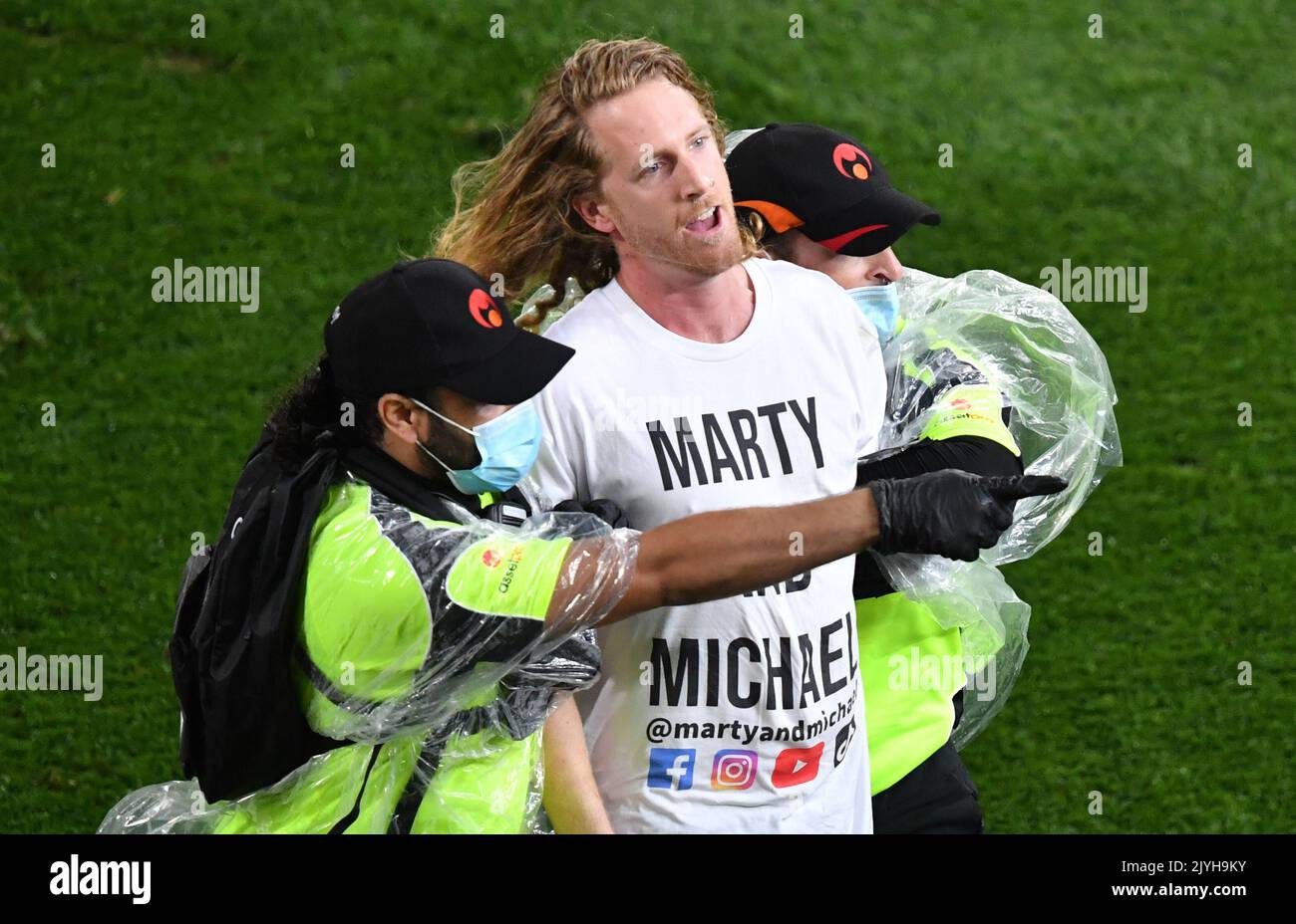 A pitch invader is seen during the AFL Grand Final between the Richmond ...
