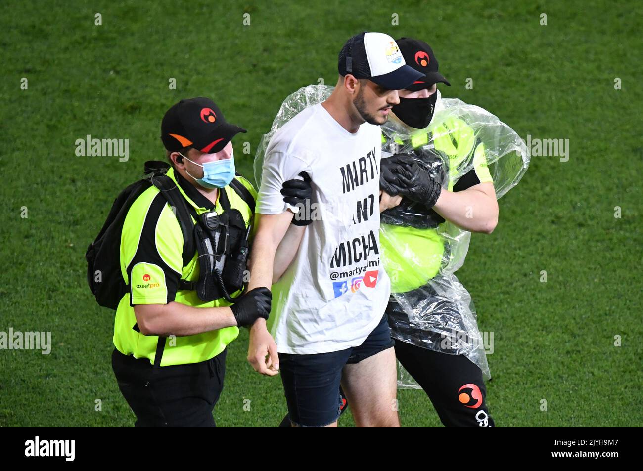 A pitch invader is seen during the AFL Grand Final between the Richmond ...