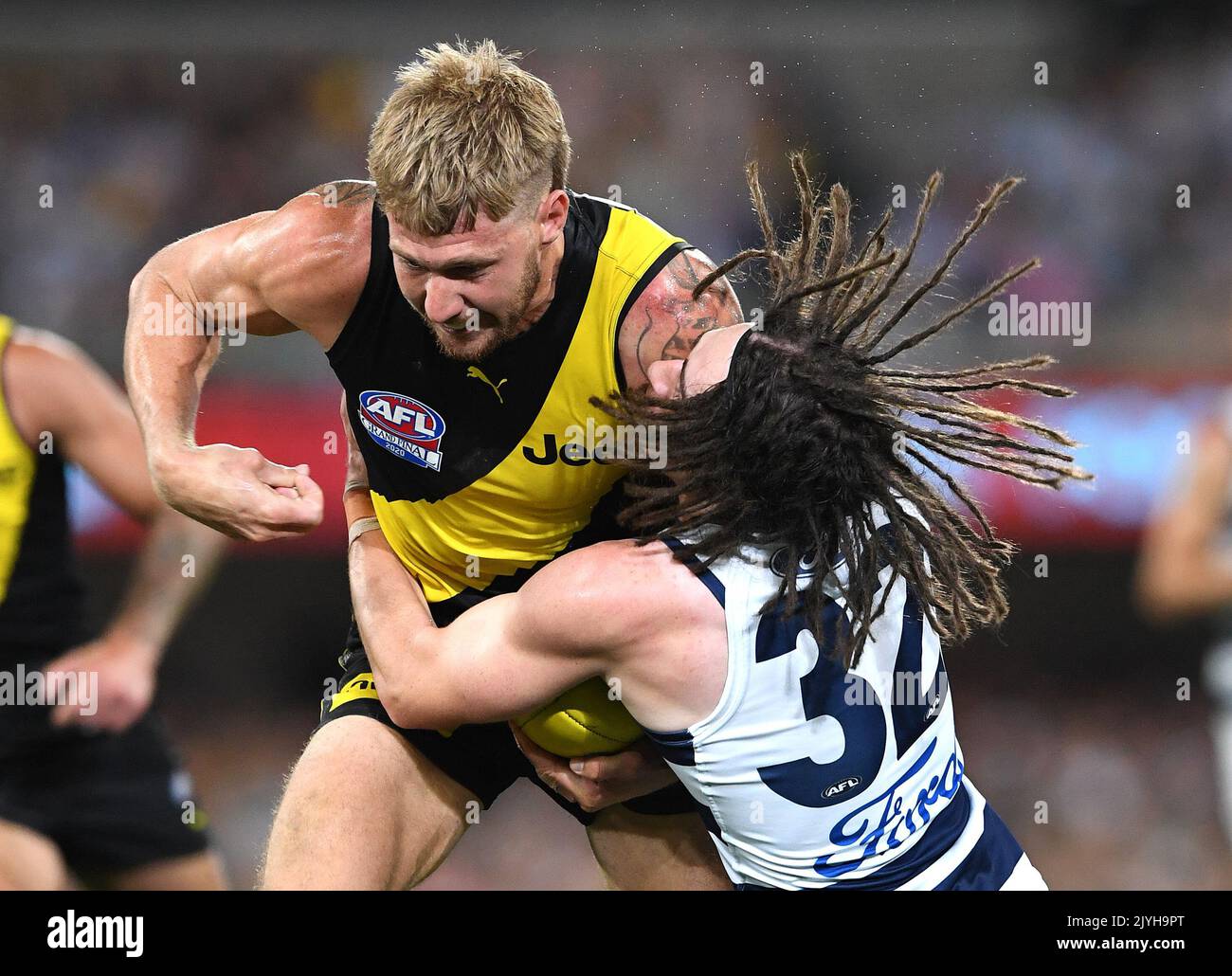 Gryan Miers of the Cats tackles Nathan Broad of the Tigers during the ...