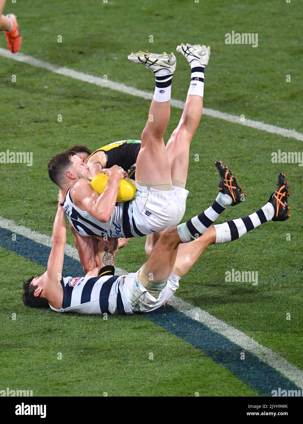 Sam Menegola (top) of the Cats is seen colliding with team mate Sam ...