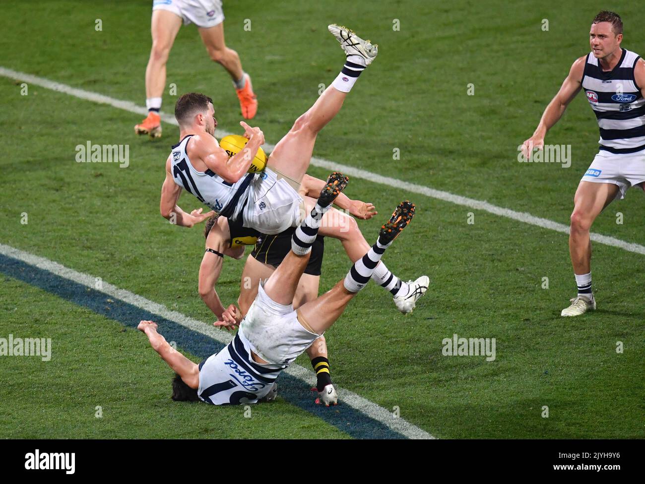 Sam Menegola (top) of the Cats is seen colliding with team mate Sam ...
