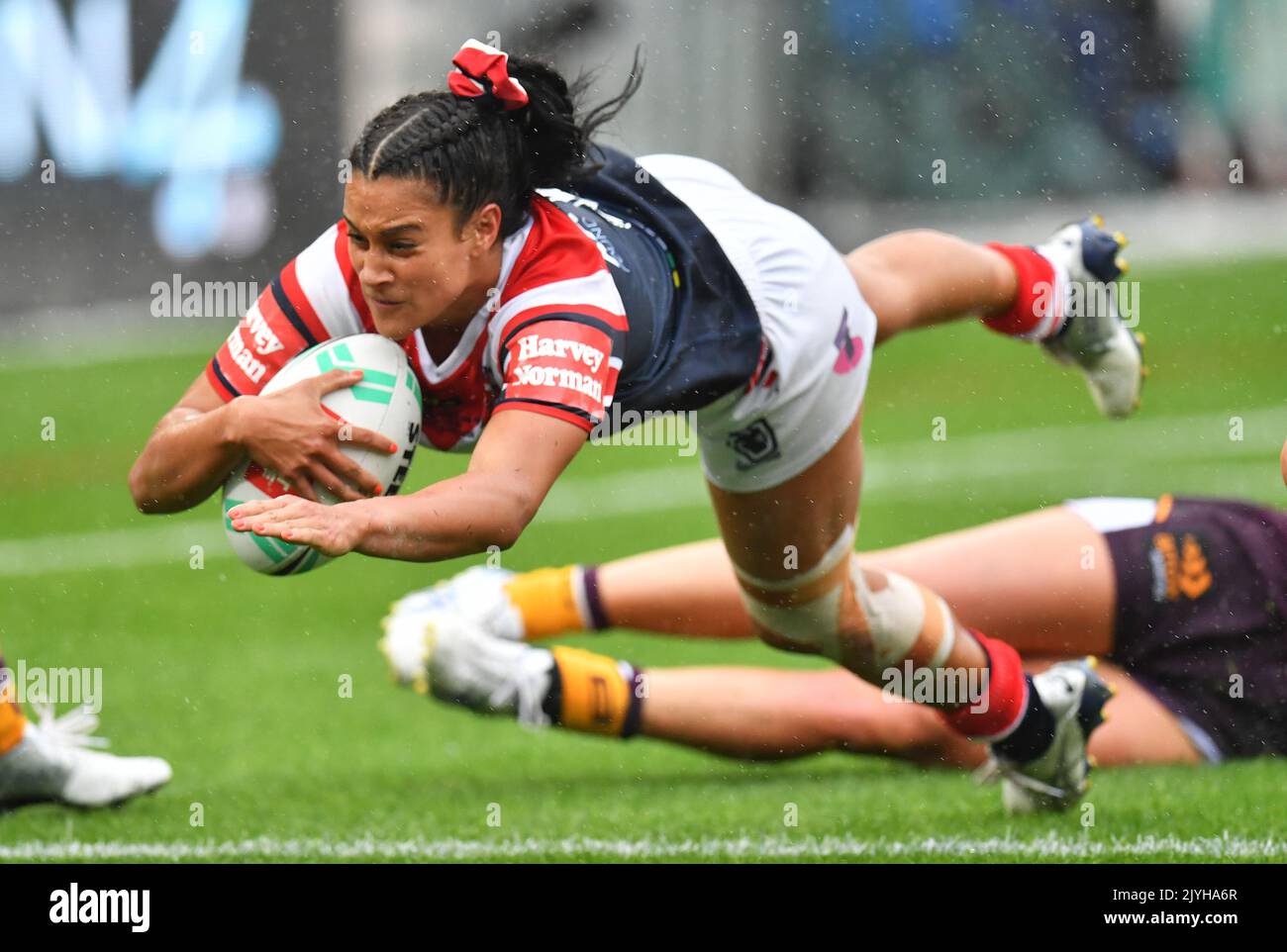 Yasmin Meakes of the Roosters crosses over to score a try during the ...