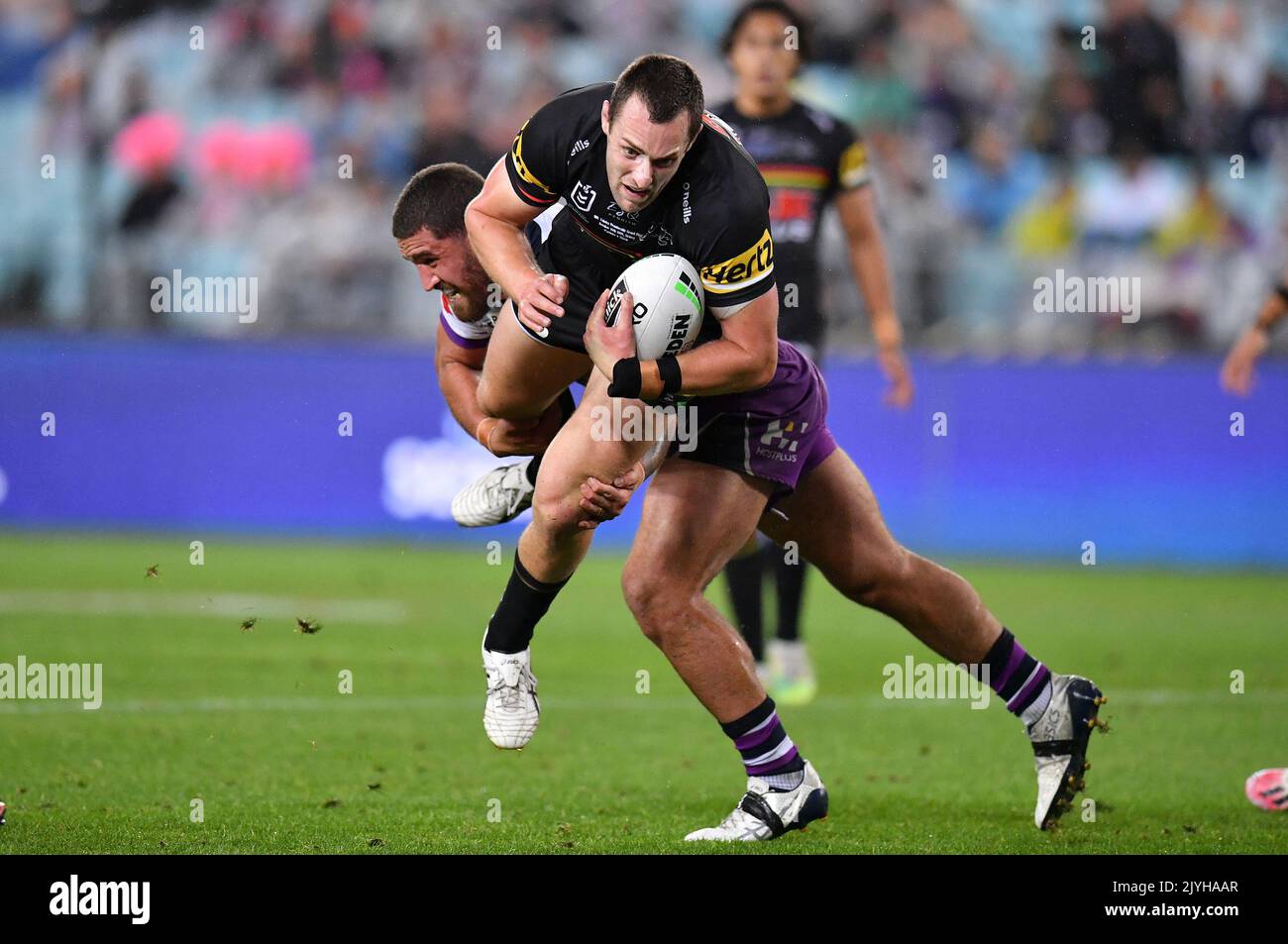 Issah Yeo of the Panthers is tackled by Brenko Lee of the Storm during ...