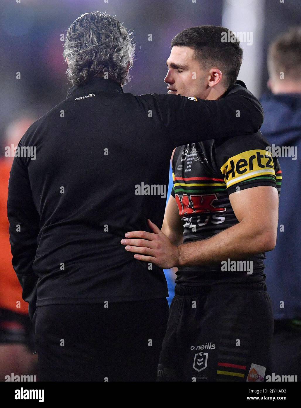 Nathan Cleary (right) reacts with father and coach Ivan Cleary ...