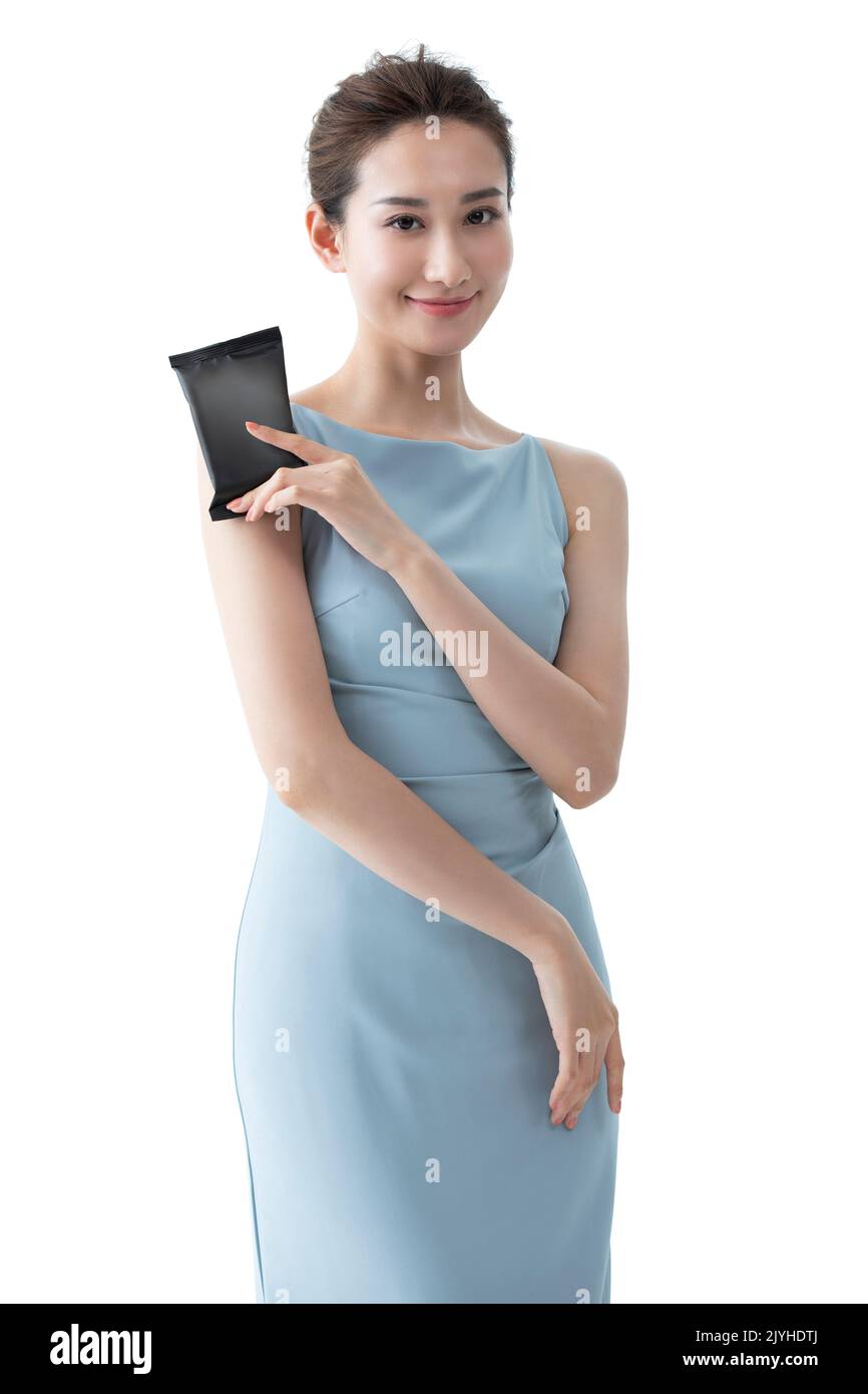 Beautiful young Chinese woman showing wet wipe Stock Photo - Alamy