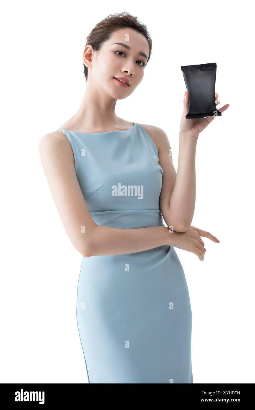 Beautiful young Chinese woman showing wet wipe Stock Photo - Alamy