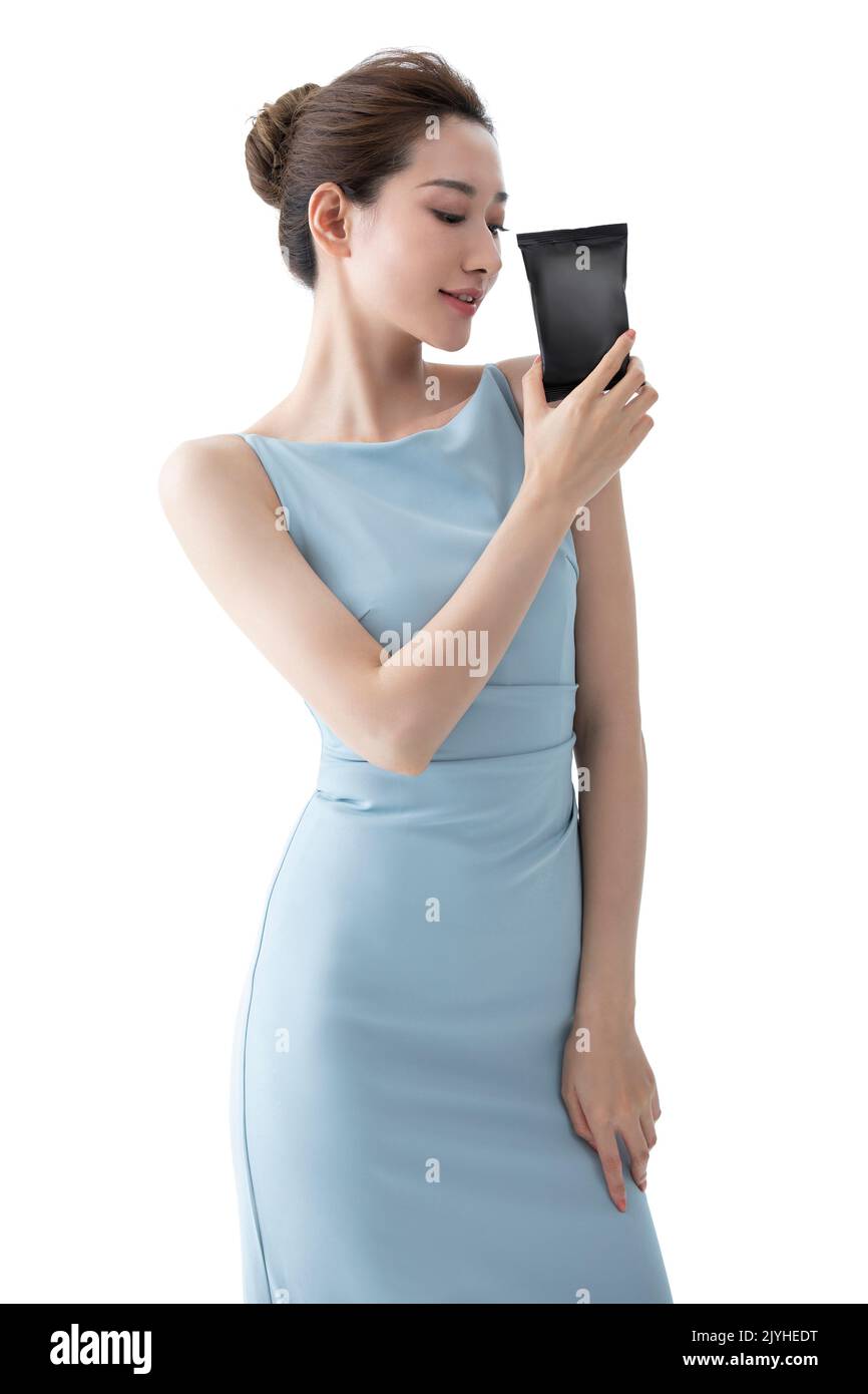Beautiful young Chinese woman showing wet wipe Stock Photo - Alamy