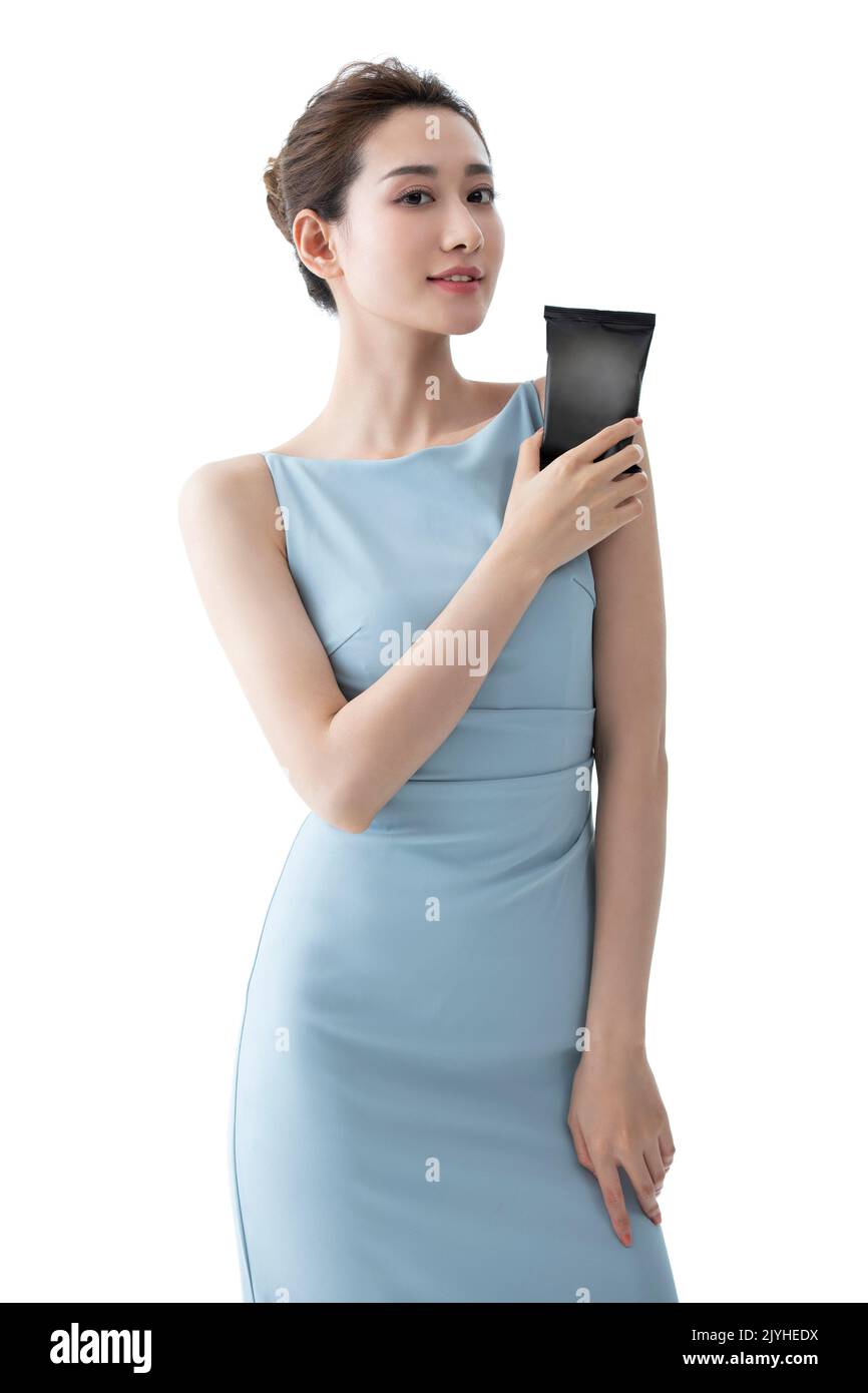 Beautiful young Chinese woman showing wet wipe Stock Photo - Alamy