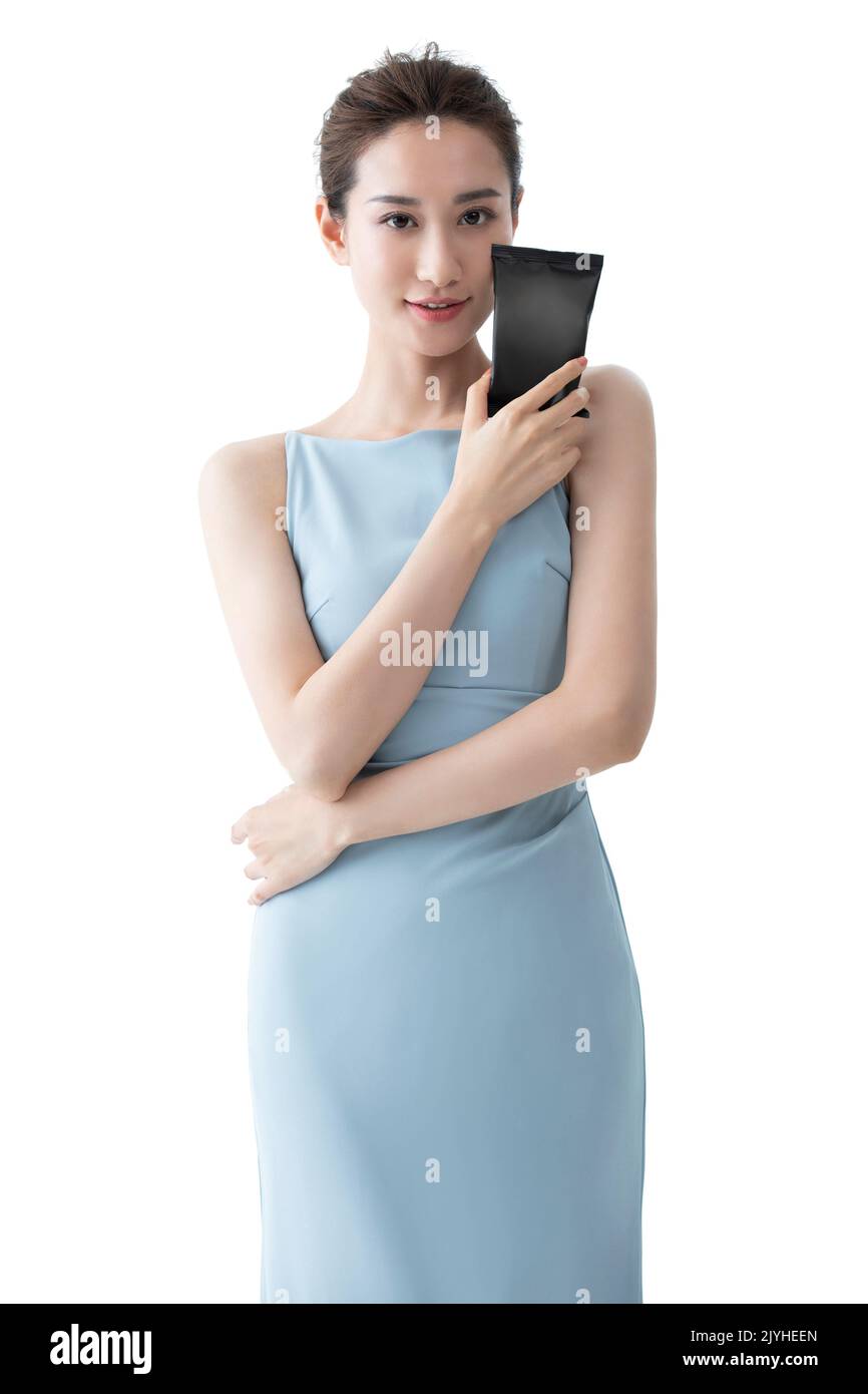 Beautiful young Chinese woman showing wet wipe Stock Photo - Alamy