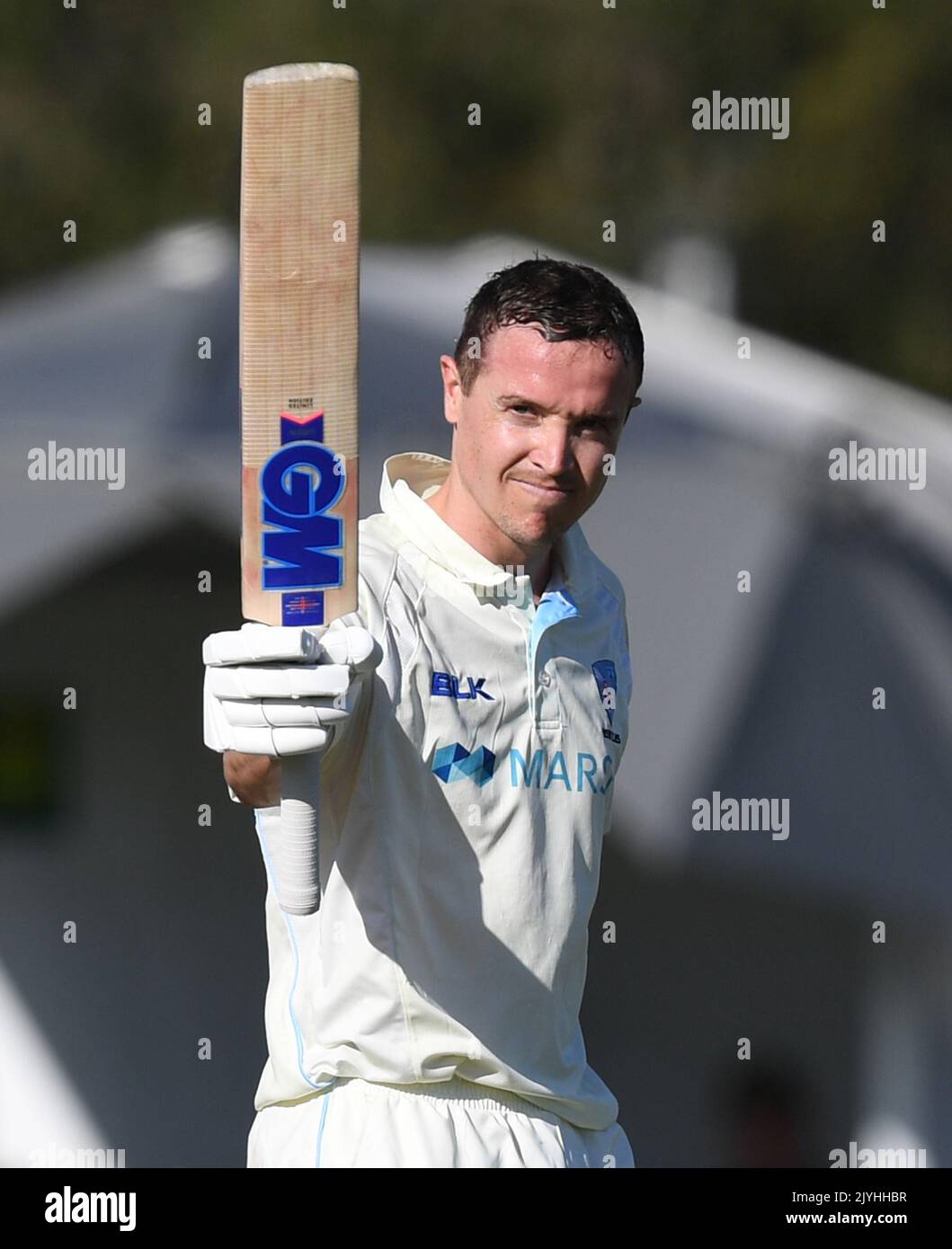 Nick Larkin of the Blues celebrates his century during day 2 of the ...