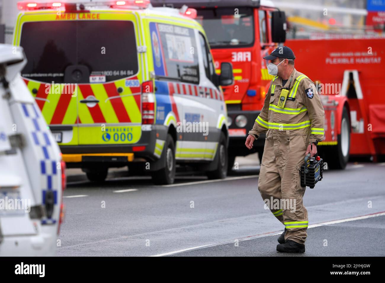 Metropolitan Fire Brigade personnel are seen near a factory fire in ...