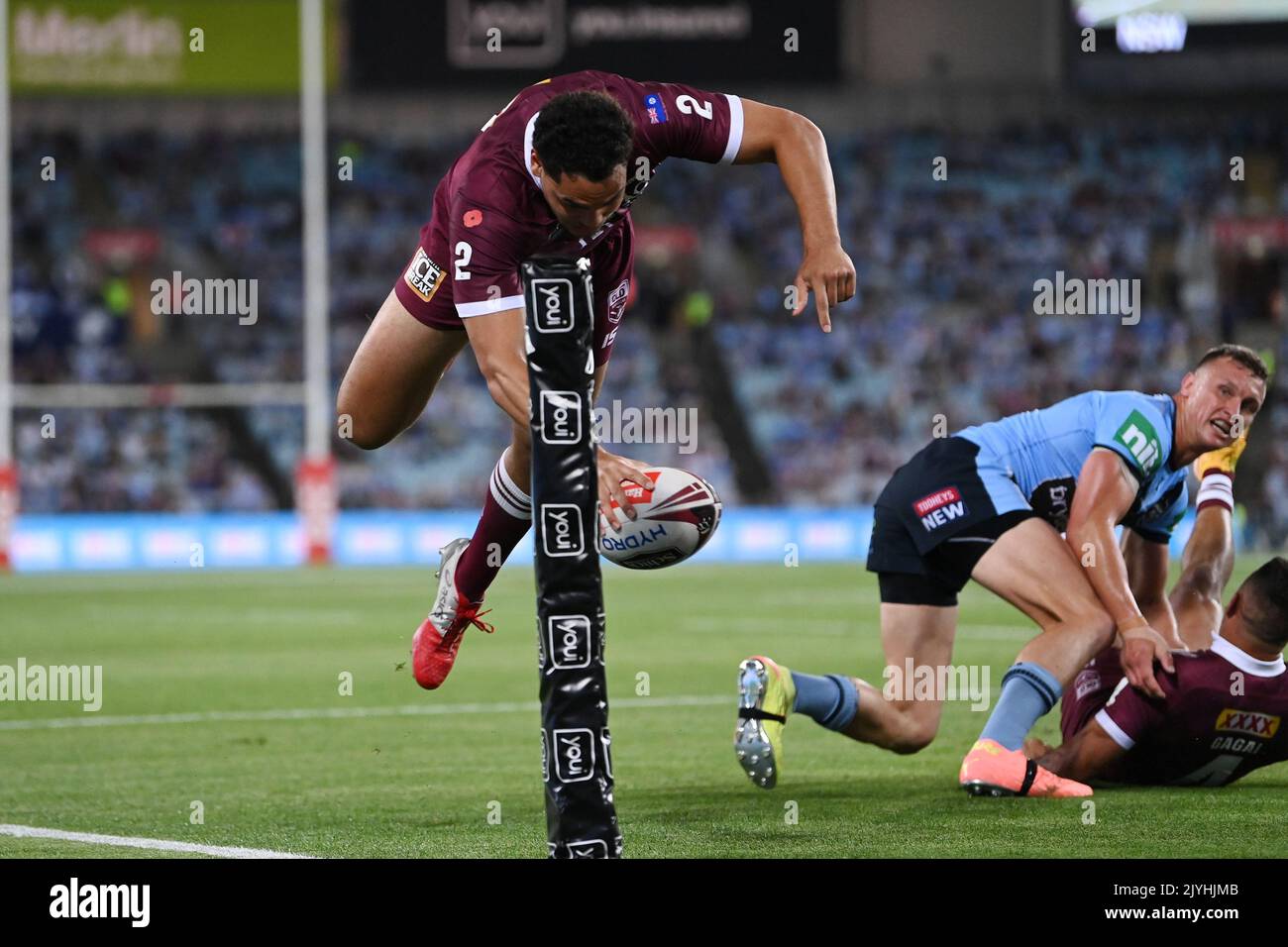Xavier Coates of the Maroons scores in the corner during Game 2 of the ...