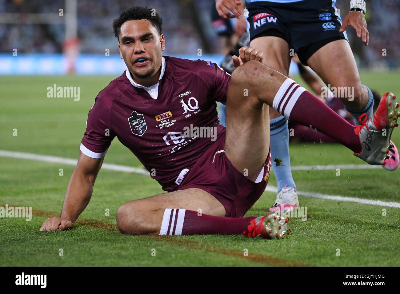 Xavier Coates of the Maroons scores the opening try during Game 2 of ...