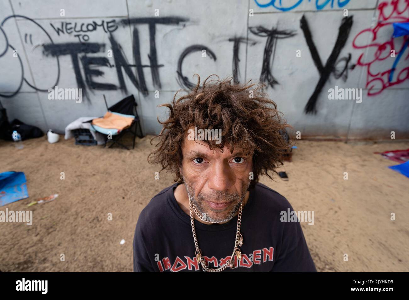 Raymond Ward poses for a photograph at the Tent City homeless camp in ...