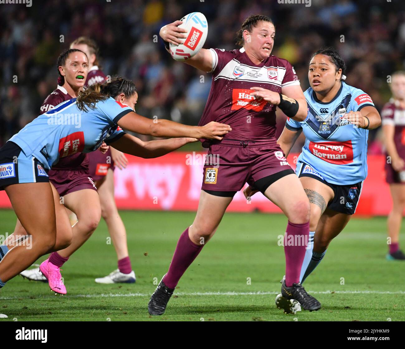 Stephanie Hancock (centre) of the Maroons in action during the Women's ...
