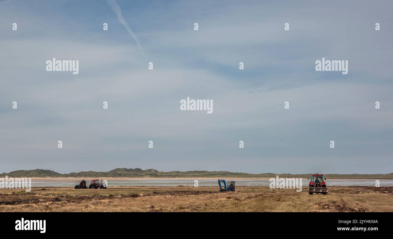 A digger and a hopper on a bog at the coast of West-Ireland Stock Photo ...