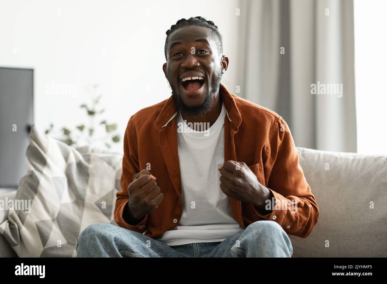 Emotional african american male shouting and gesturing YES in joy ...