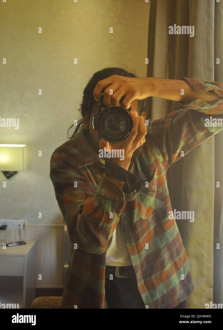 A Male Photographer Taking Selfie With His Dslr Camera In Front Of