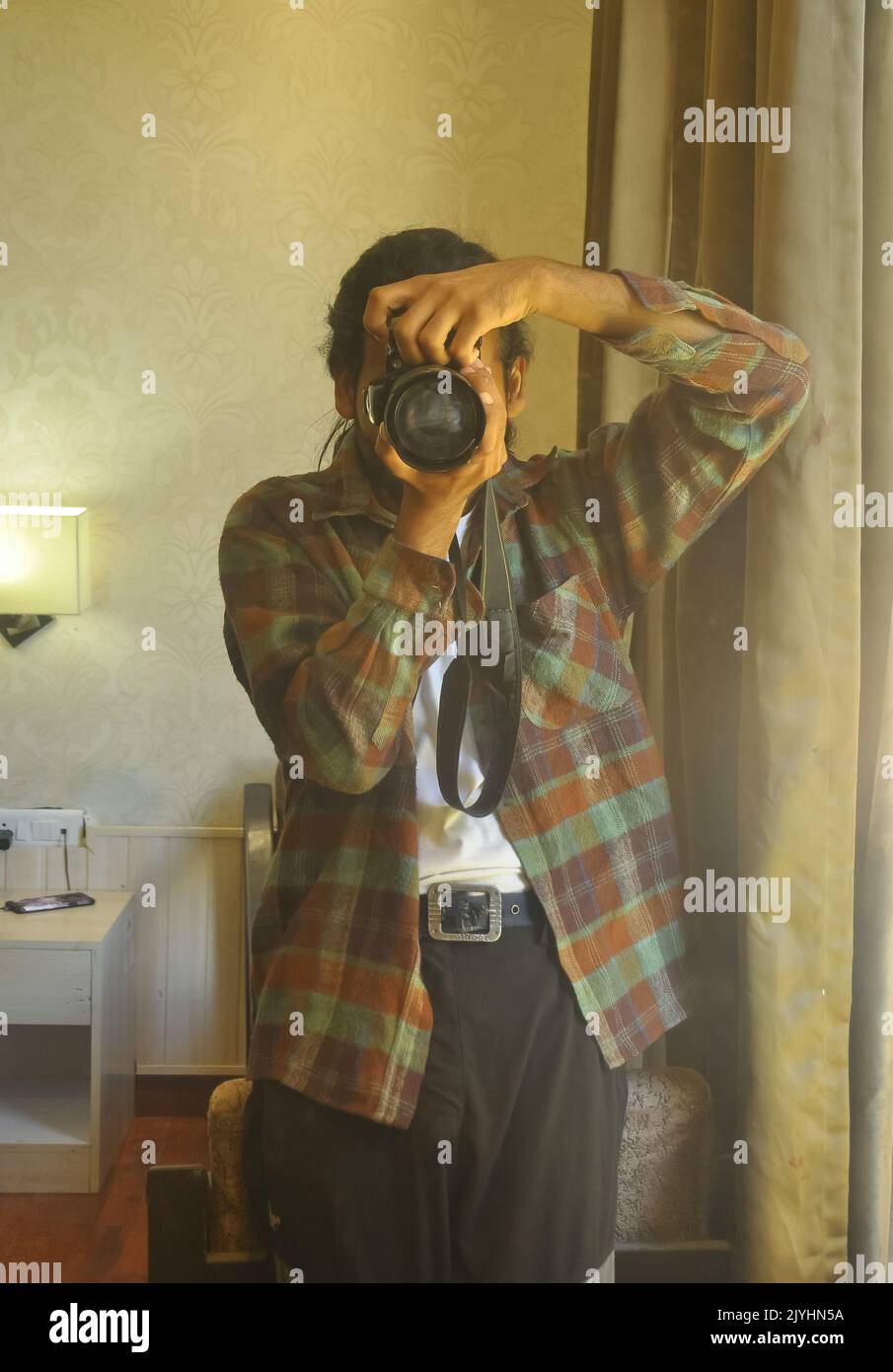 A Male Photographer Taking Selfie With His Dslr Camera In Front Of