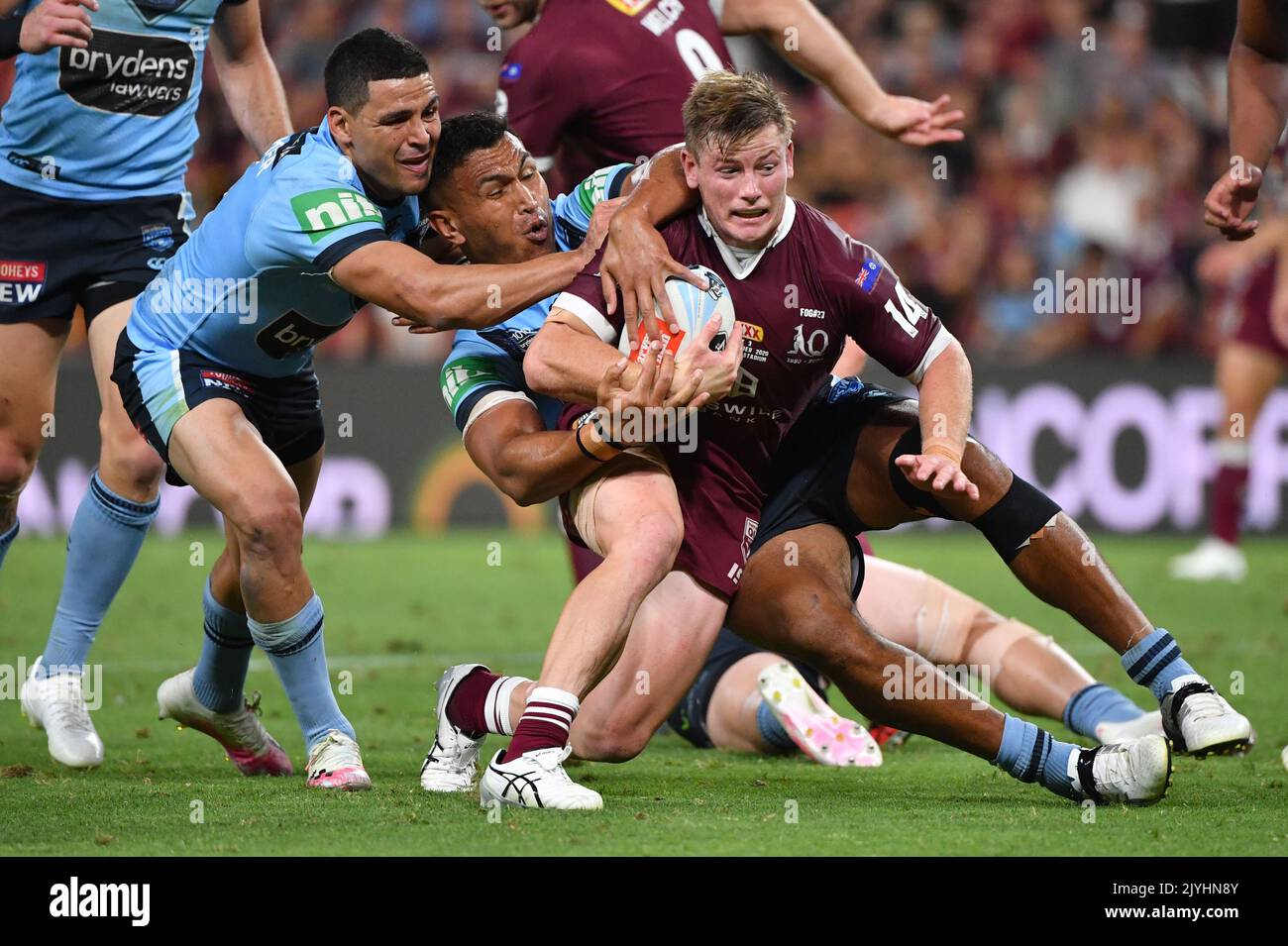 Harry Grant (right) of the Maroons makes a break for the try line try ...