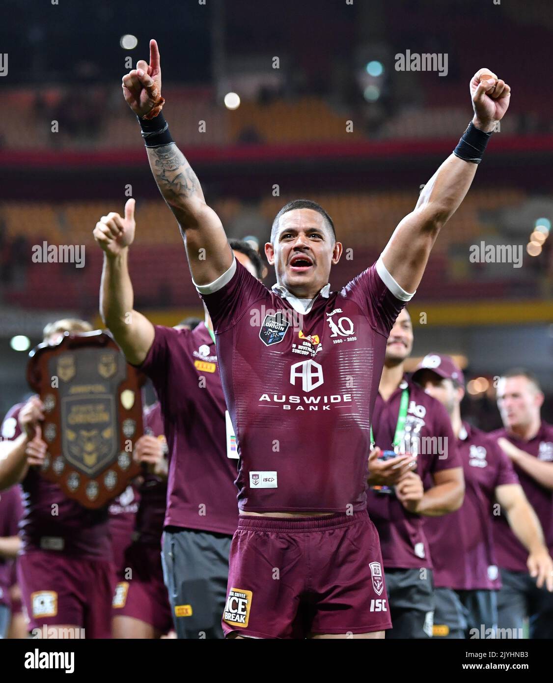 Dane Gagai (centre) of the Maroons and team mates celebrate winning the ...
