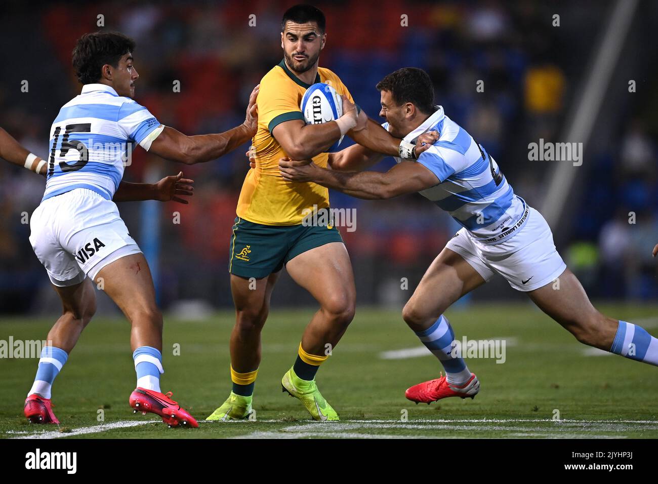 Tom Wright of the Wallabies is tackled by Emiliano Boffelli (right) of ...