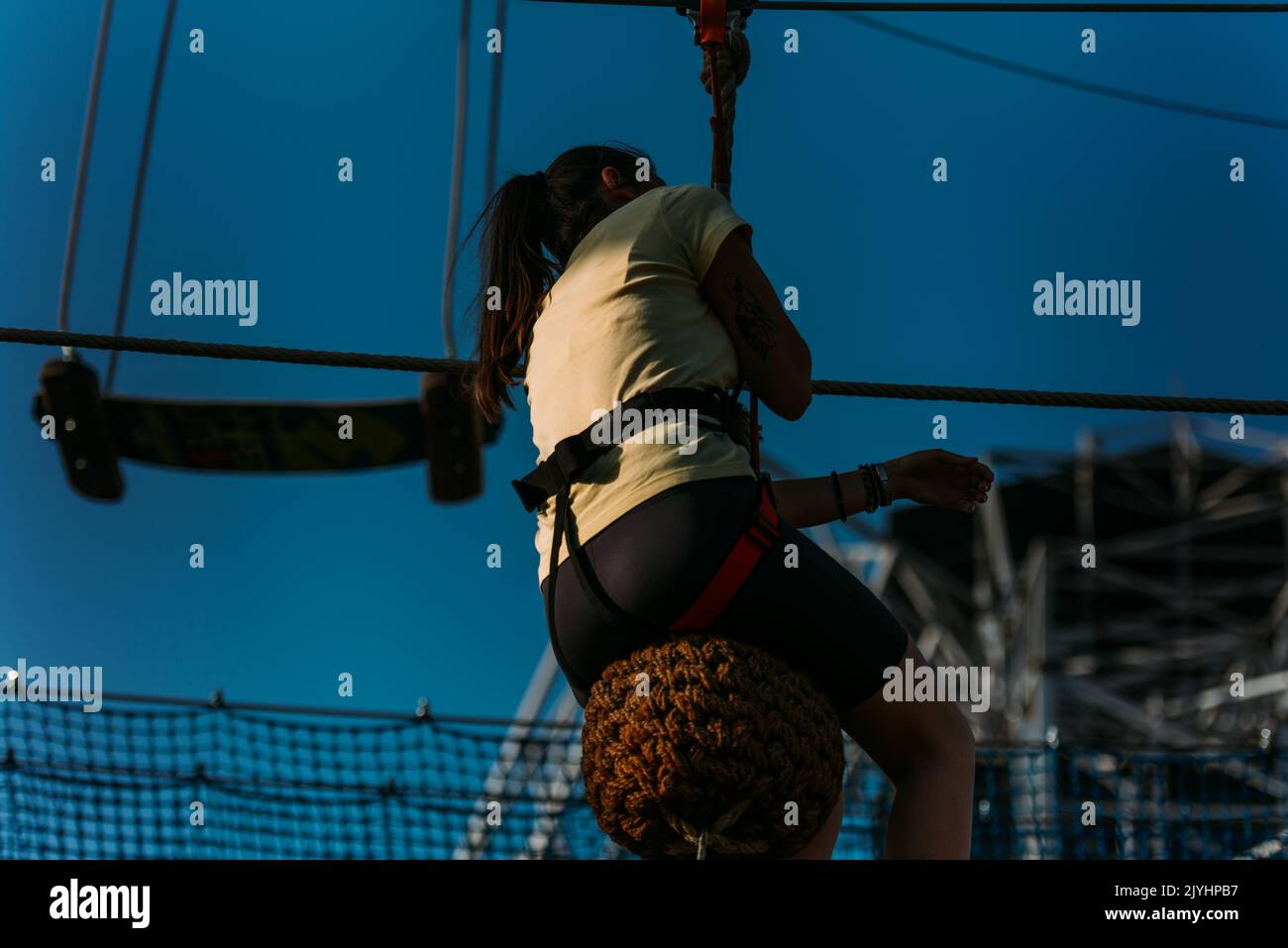 Adventurous woman on zip line hi-res stock photography and images - Alamy