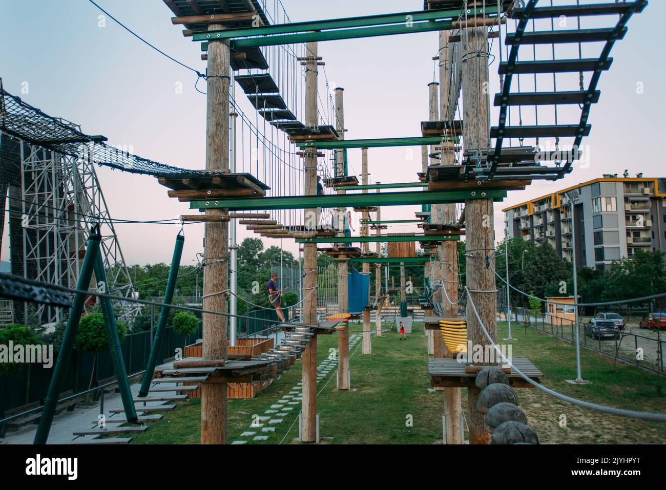 Many adventure people standing at the adventure park at different ...