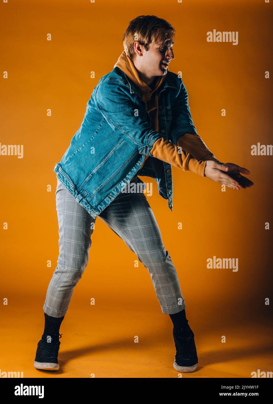Muscular dance performer practicing dance moves at the studio Stock ...