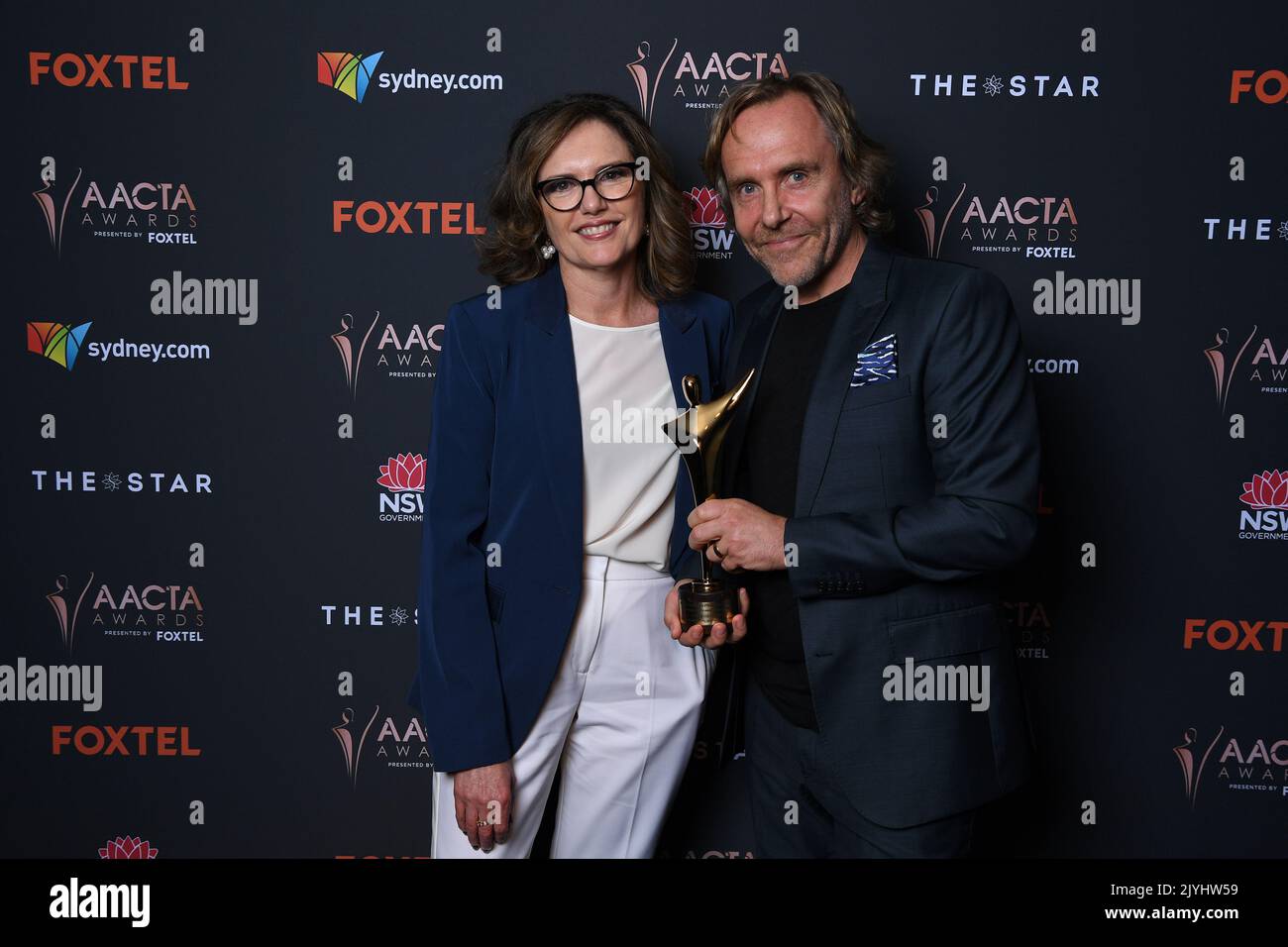 Robyn Butler and Wayne Hope pose with the award for Best Online Drama ...