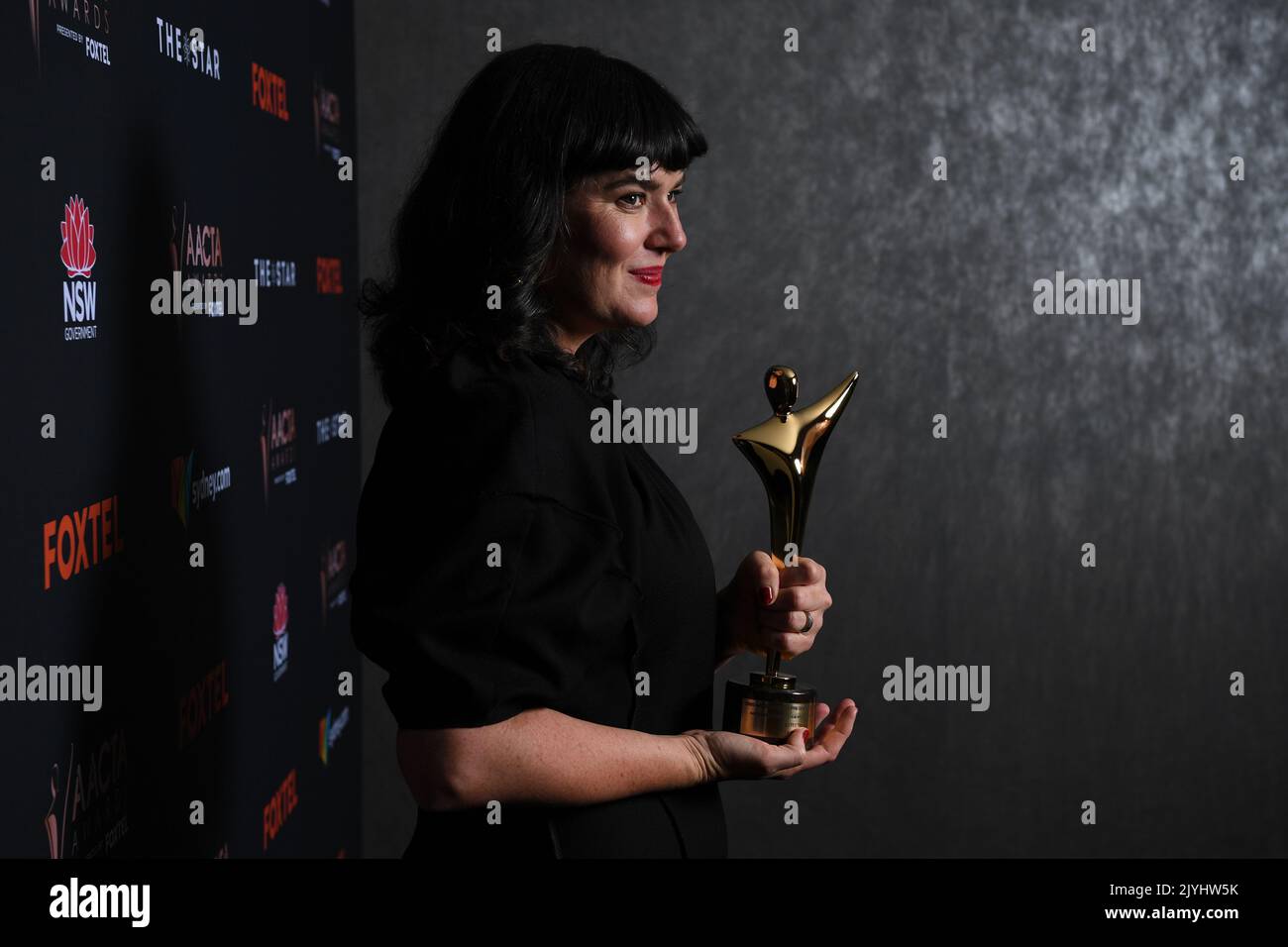 Alex White poses with the award for Best Film at the 2020 AACTA Awards ...