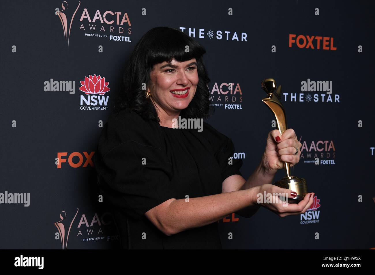 Alex White poses with the award for Best Film at the 2020 AACTA Awards ...
