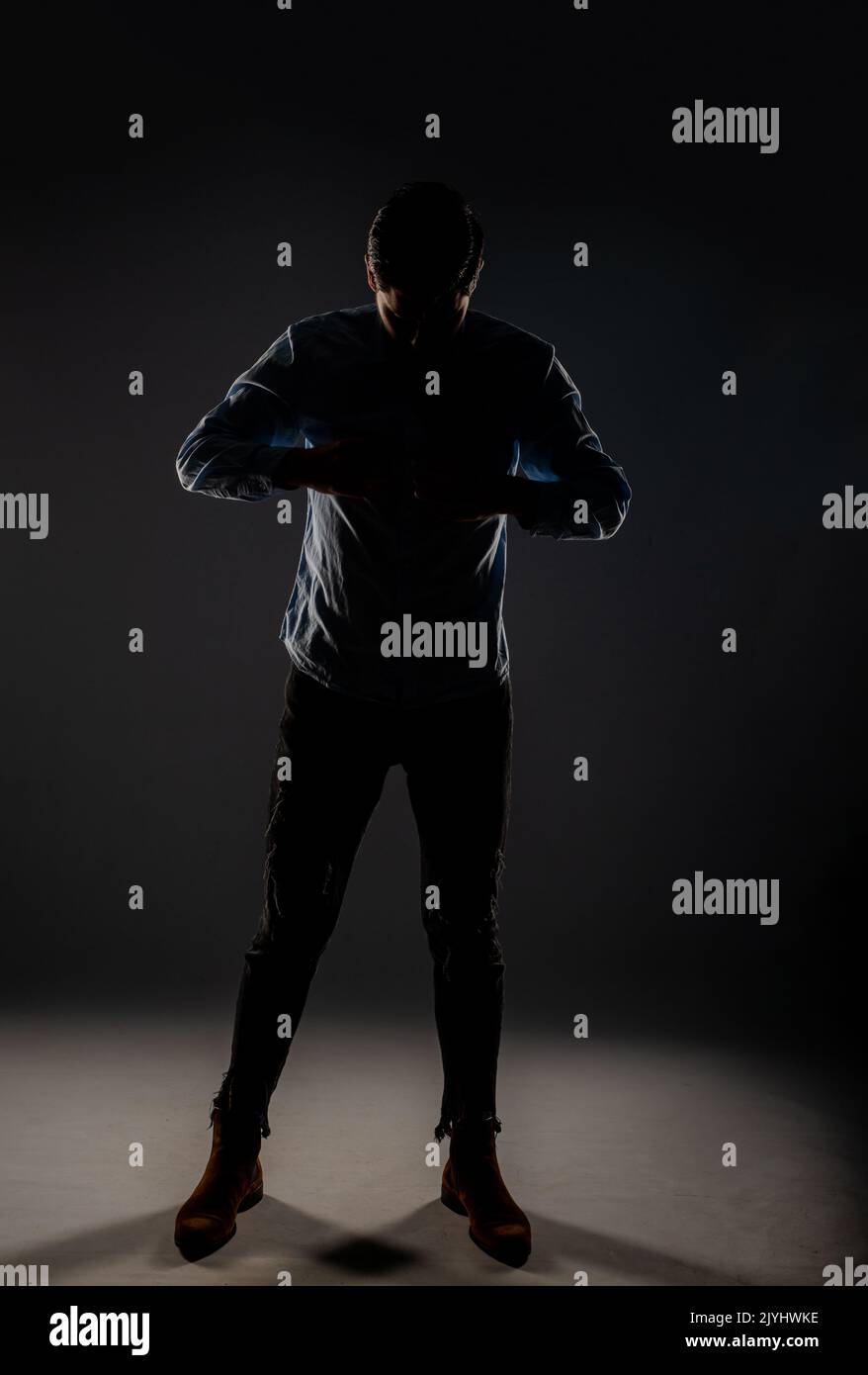 Dimmed light man hi-res stock photography and images - Alamy