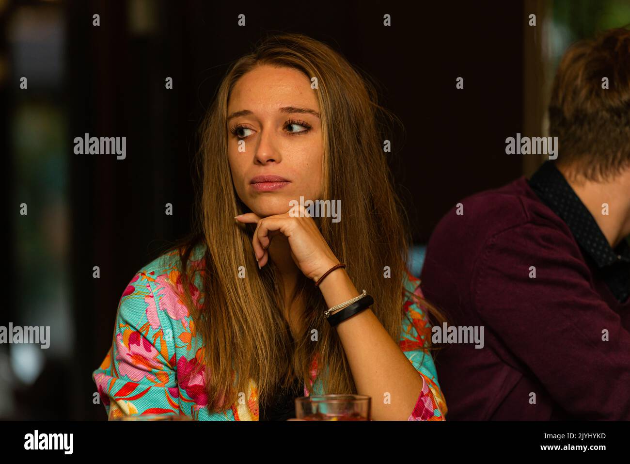 Attractive and beautiful young girl is listening to her boyfriend Stock ...