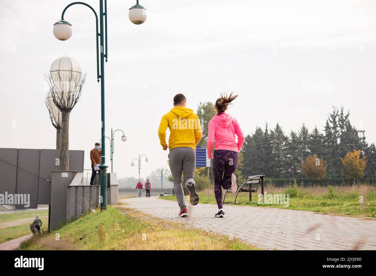 Amazing and beautiful strong couple is running slowly together Stock ...