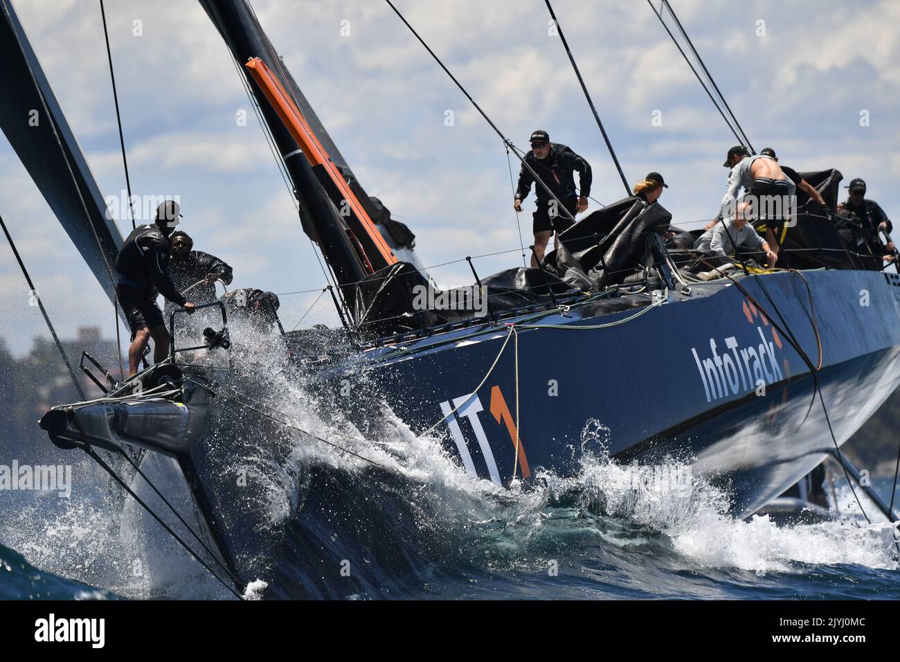 Crew onboard the Super Maxi InfoTrack prepare a sail during the annual ...