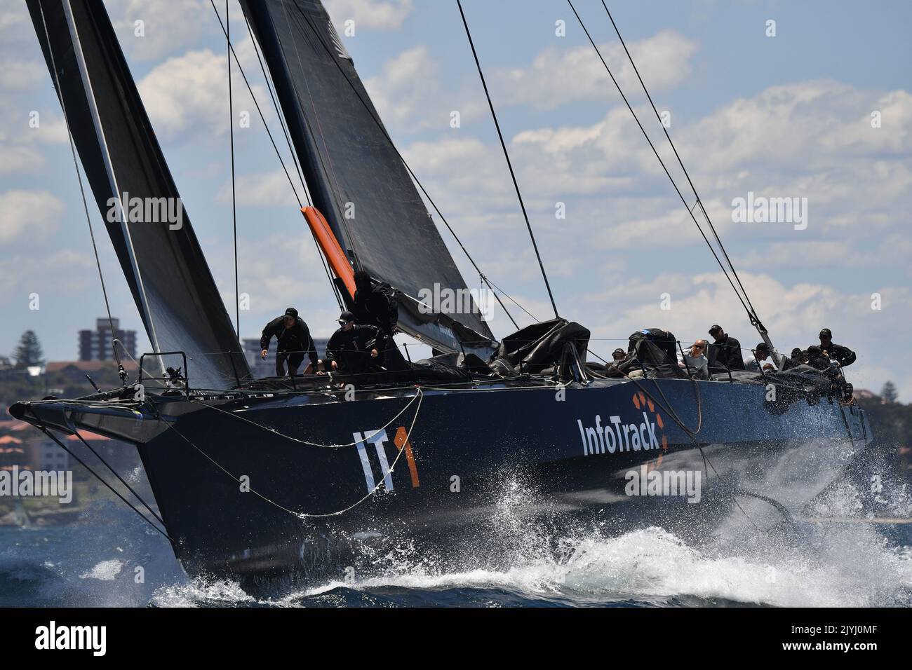 Crew onboard the Super Maxi InfoTrack prepare a sail during the annual ...