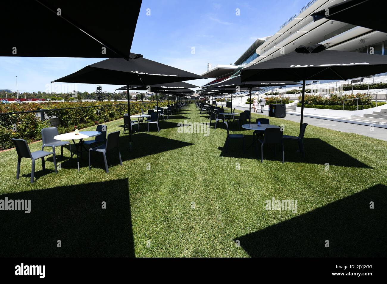 Socially distanced tables are seen by the racetrack during the Living ...