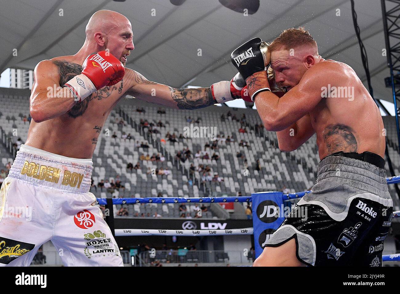 Tyson Lantry (left) strikes Luke Jackson in their under card bout ...