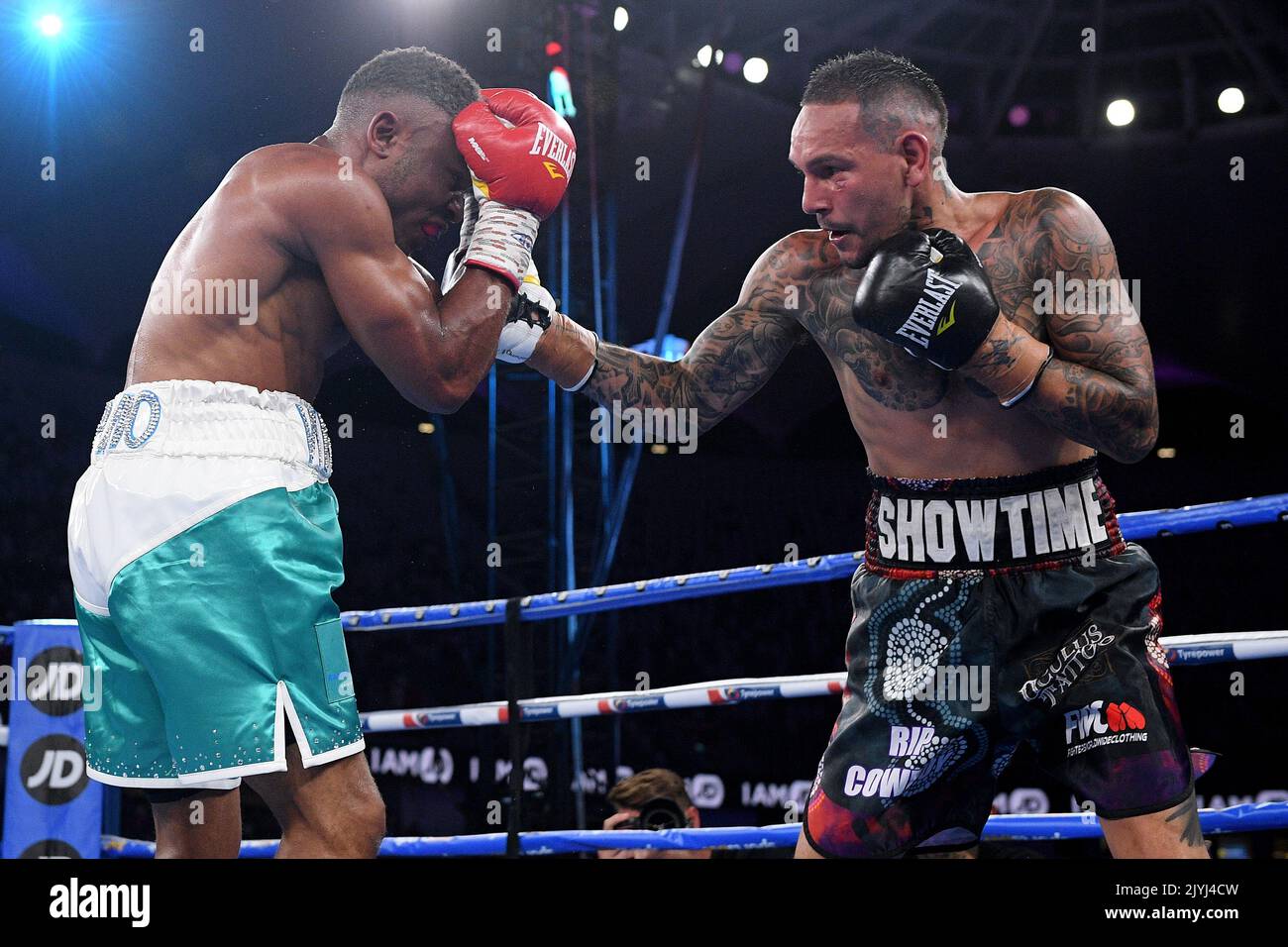 Paul Fleming (right) strikes Bruno Tarimo in their under card bout ...