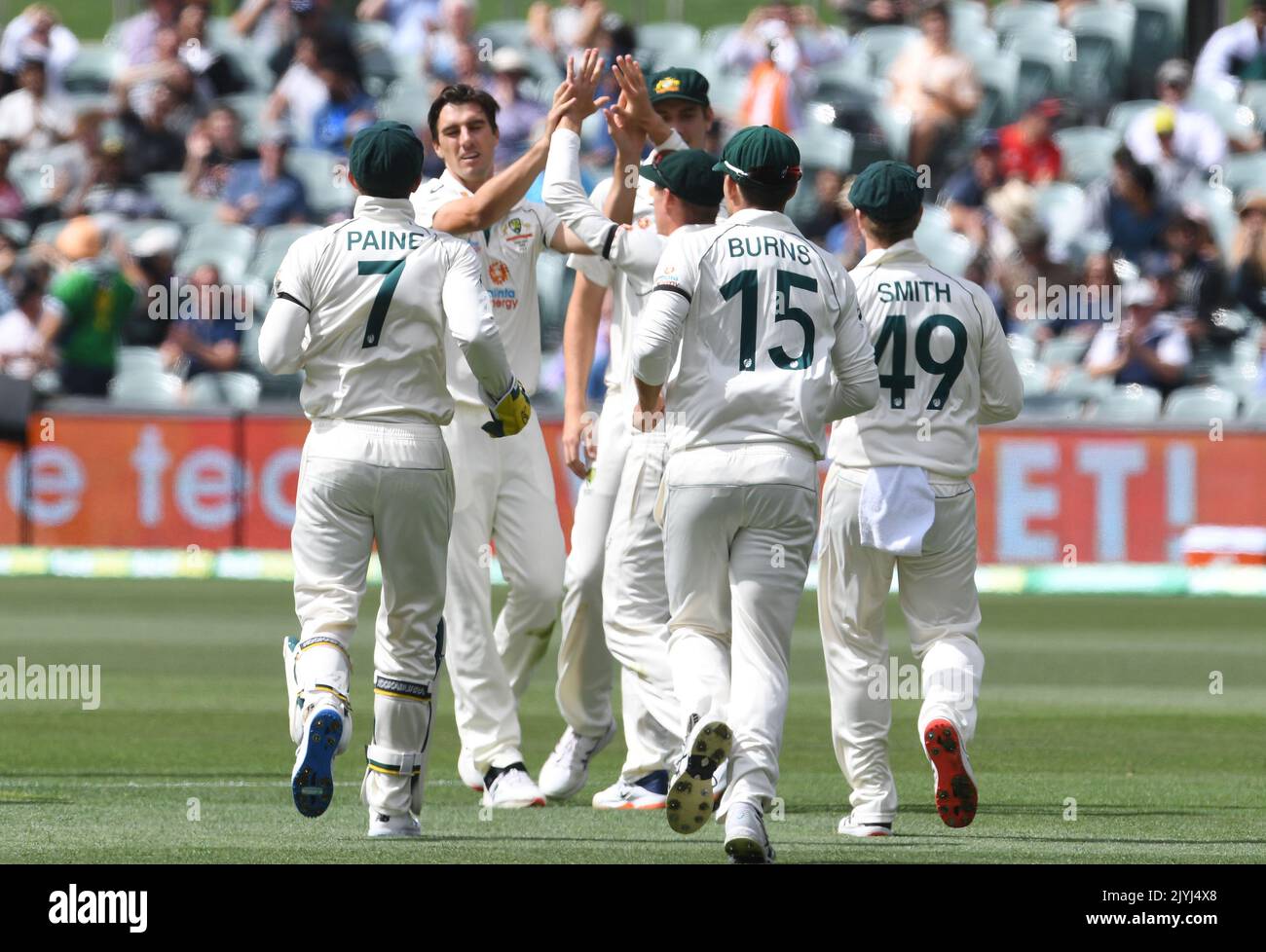 Australia bowler Pat Cummins (centre) reacts after dismissing Indian ...