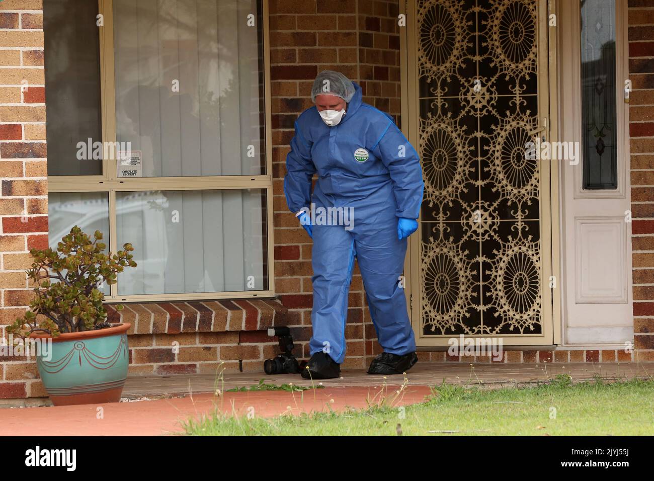 Queensland police and forensics at a house that is the scene of double ...