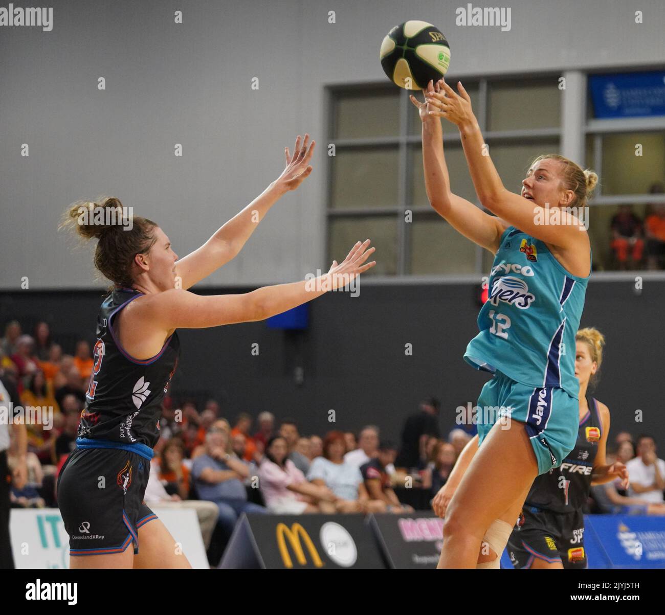 Rachel Jarry of the Southside Flyers and Nadeen Payne of the Townsville ...